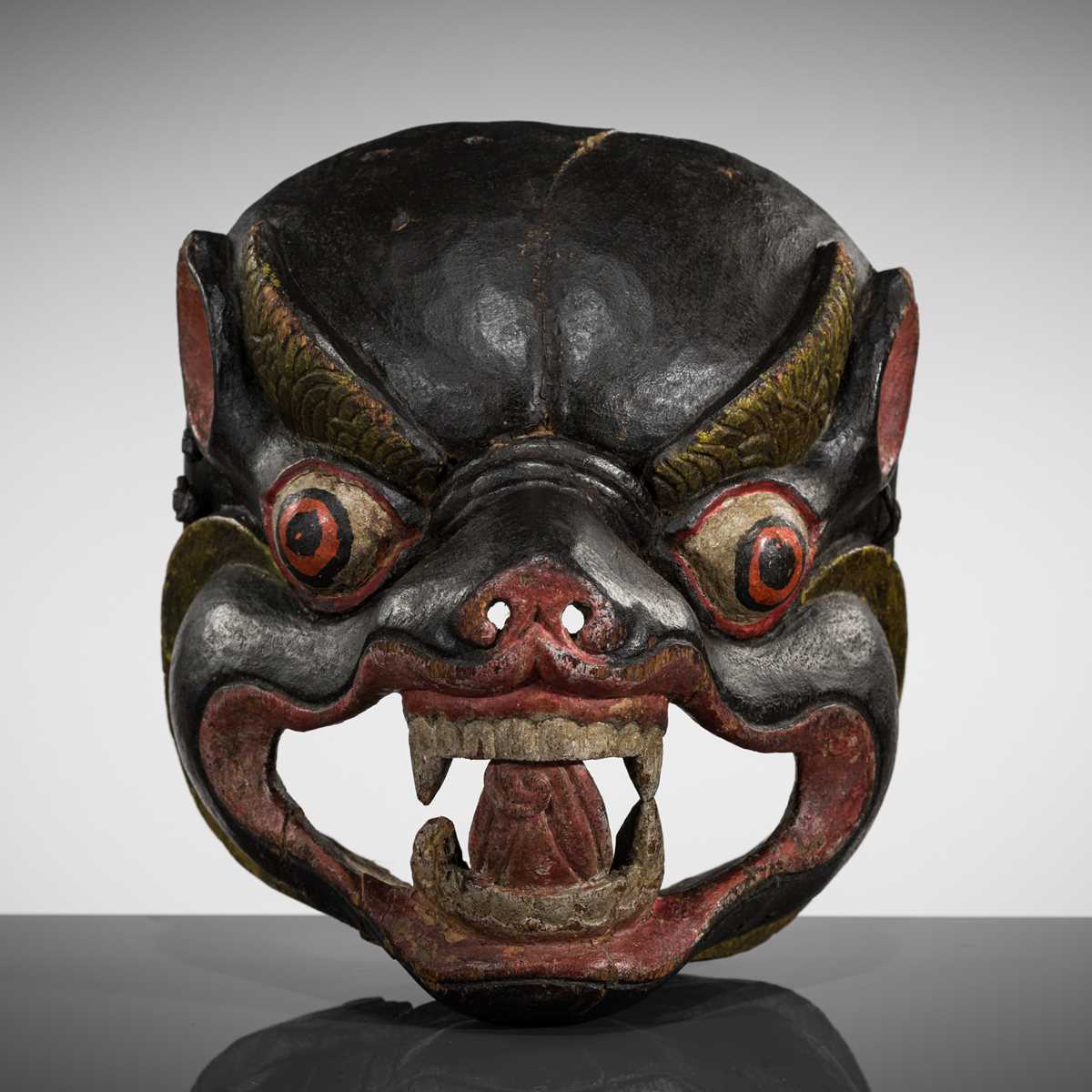 Lot 320 - A MONPA ‘WILD BOAR’ RITUAL WOOD MASK, PHAG