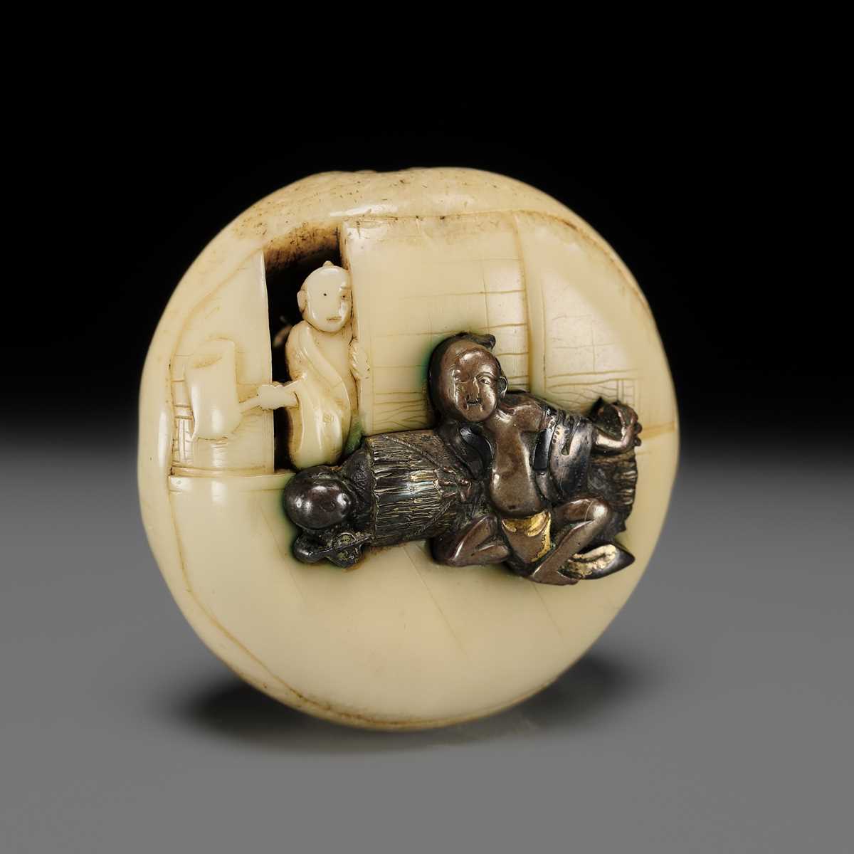 Lot 324 - A RARE METAL-INLAID WALRUS TUSK RYUSA MANJU